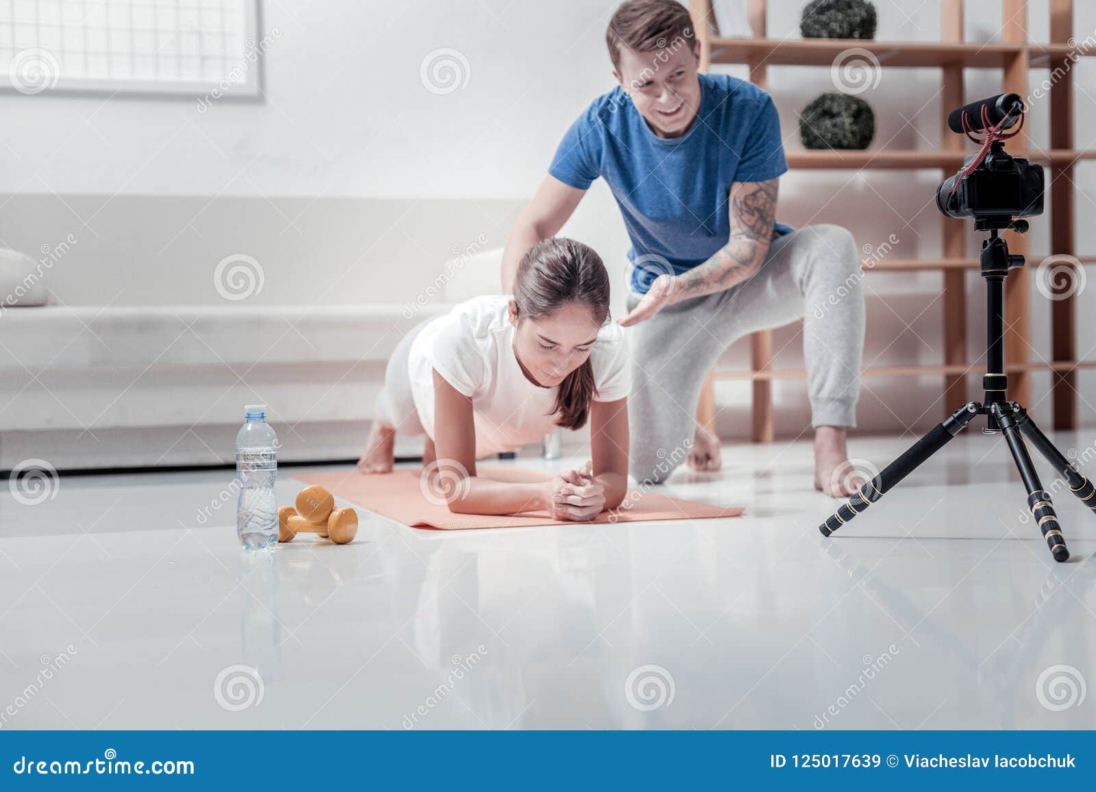 Handsome Trainer Showing Exercises with His Assistant Stock Image ...