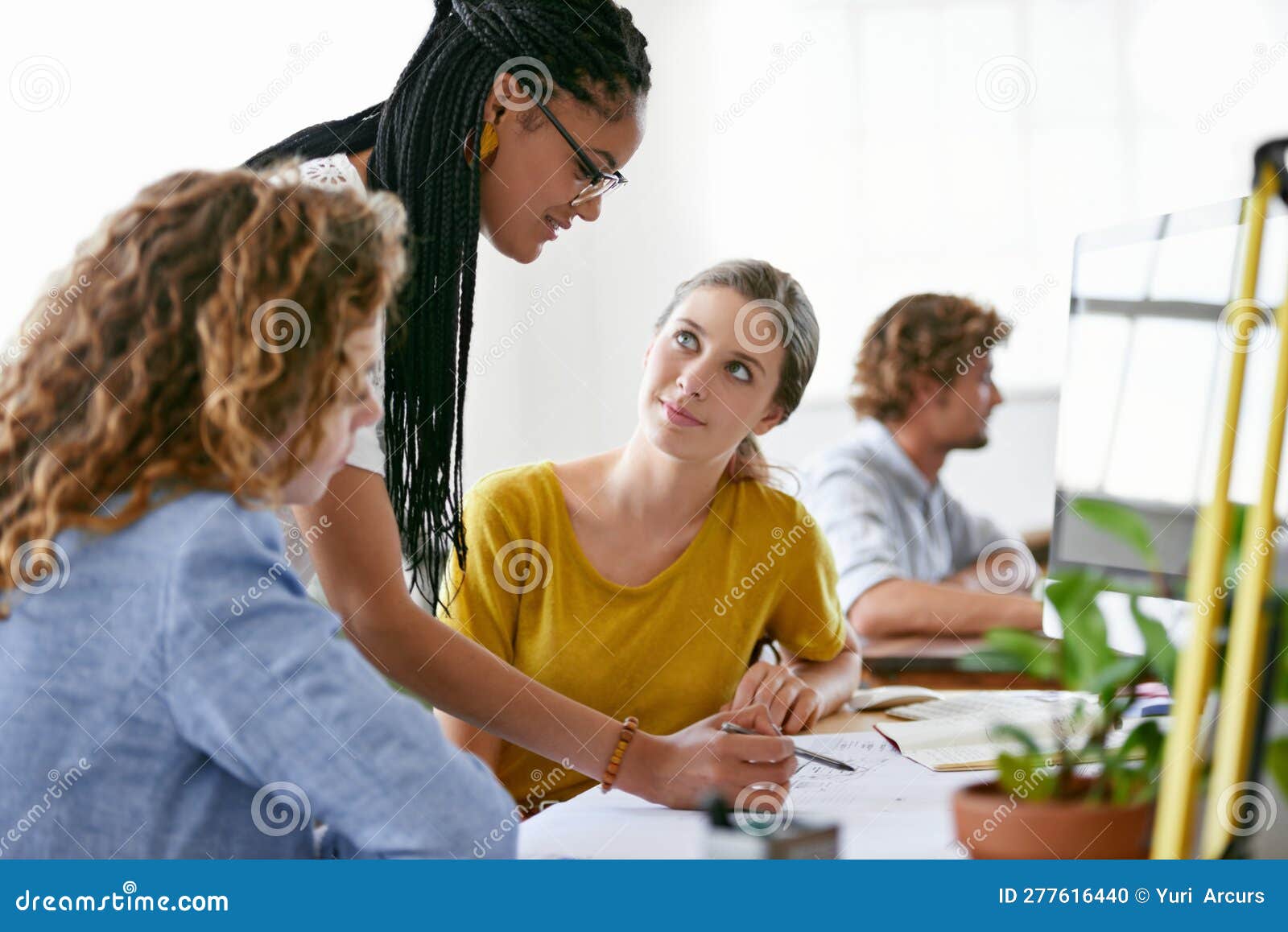 Sharing Her Ideas with the Team. a Group of Designers Working Together ...