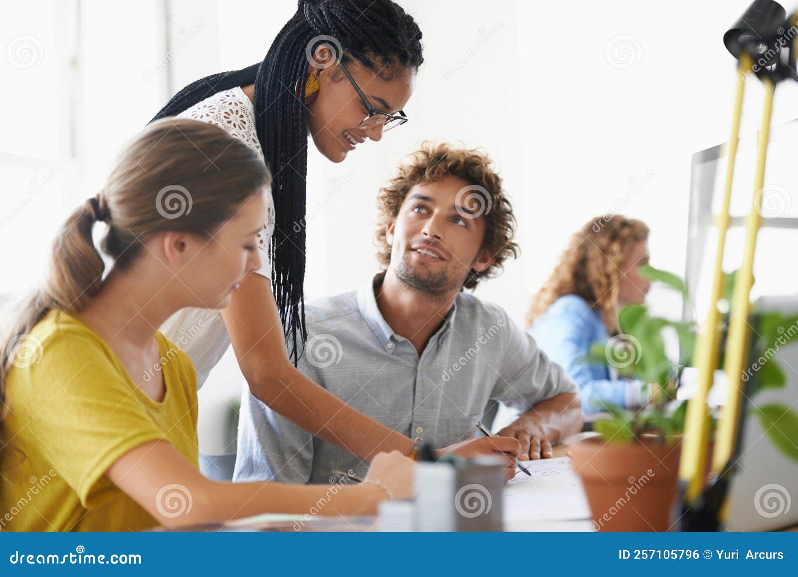 Sharing Her Work Experience. a Group of Young Colleagues Working on a ...