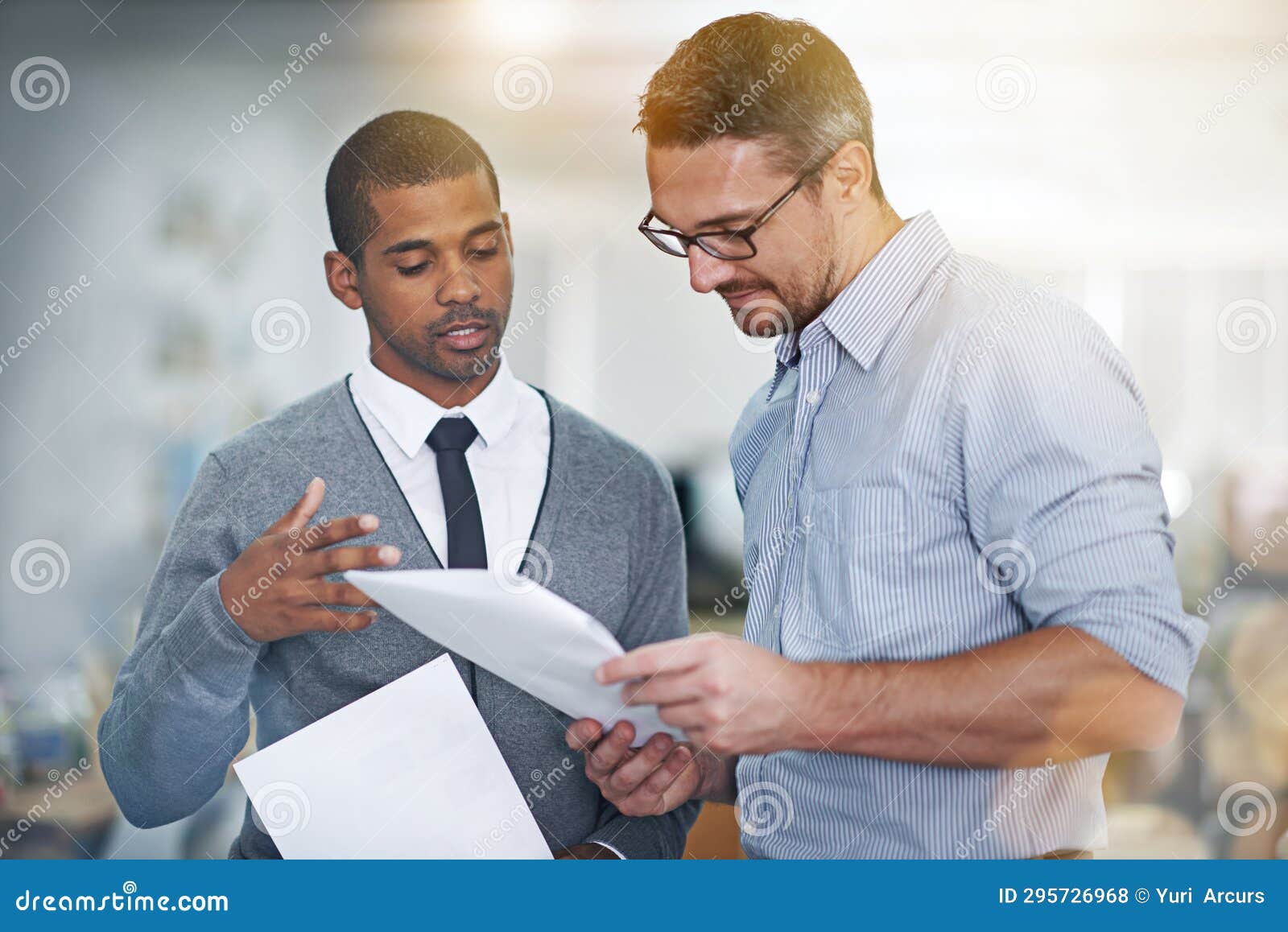 Sharing His Ideas. Two Businessmen Discussing Paperwork. Stock Photo ...