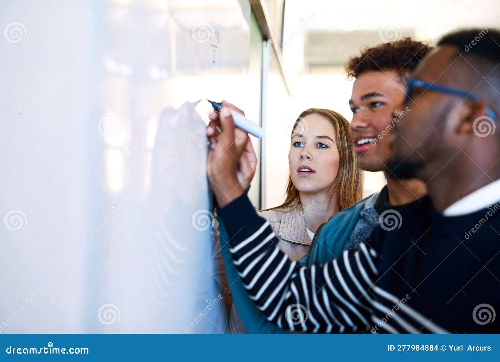 Sharing His Technique with the Group. a Young Man Writing on a ...