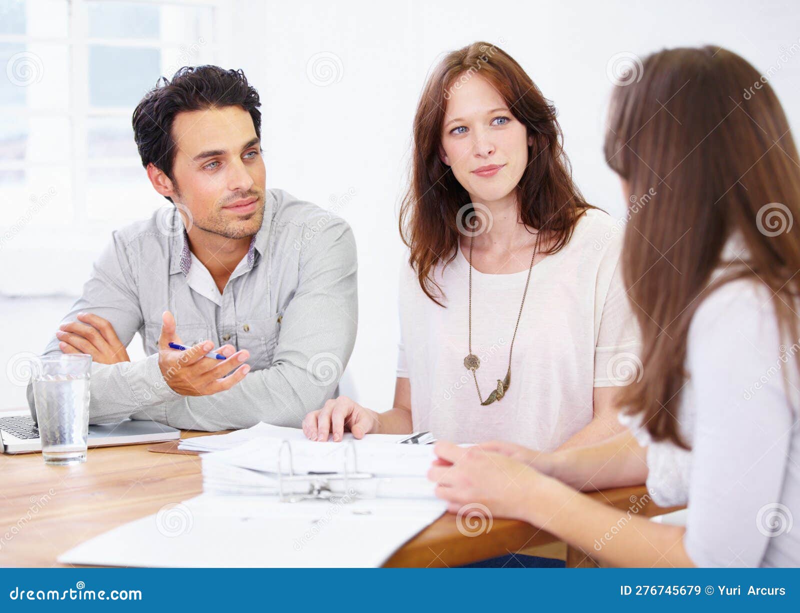 Sharing Ideas...a Group of Young Design Professionals Sitting at a ...