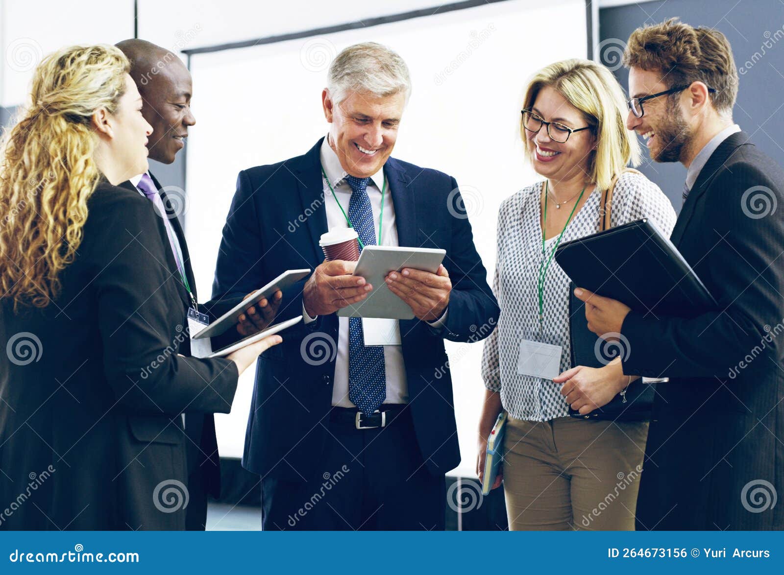 Sharing Information. a Group of Corporate Businesspeople Standing in a ...