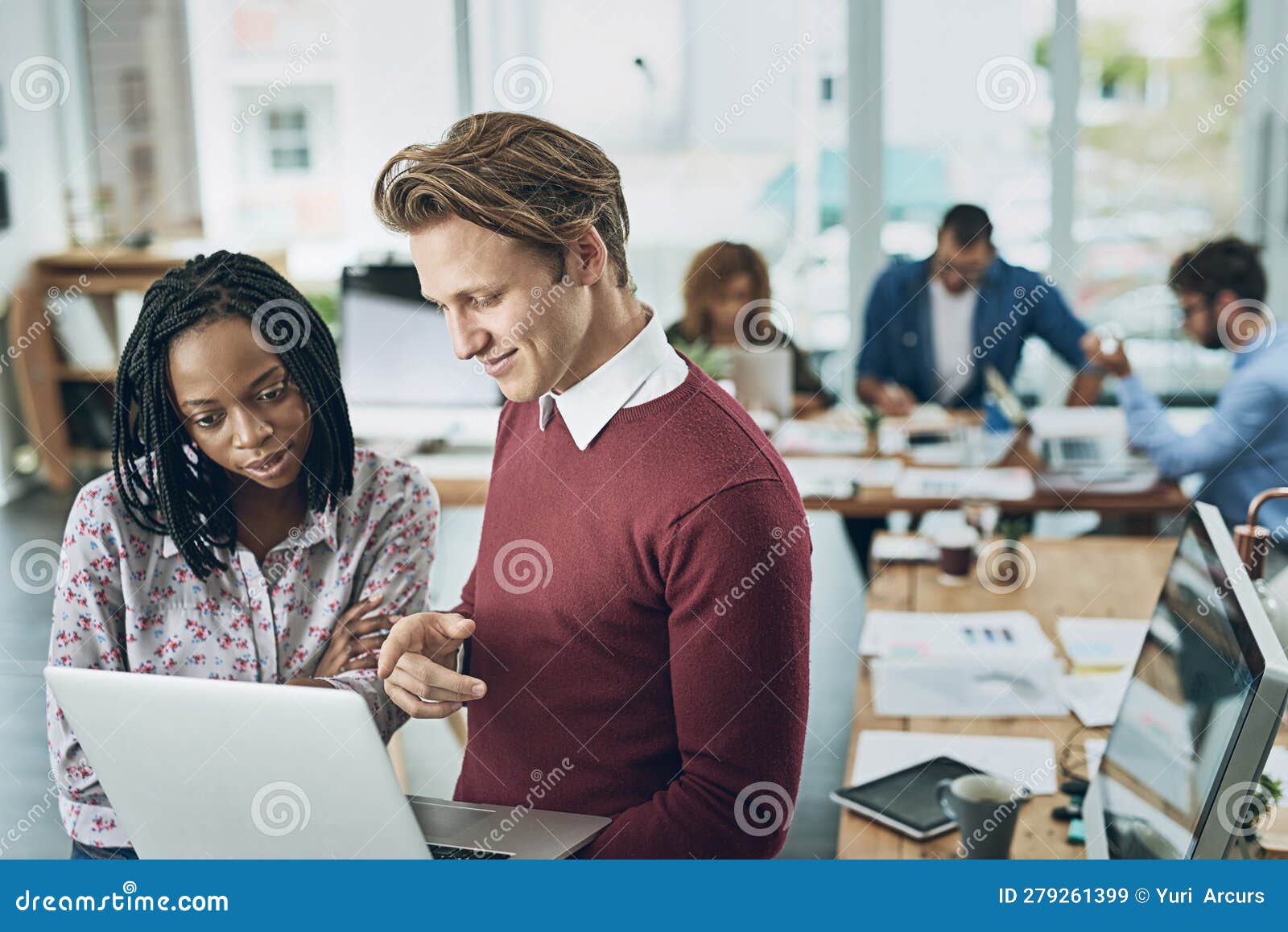 Sharing Information is a Win Win Situation. Two Young Colleagues Using ...