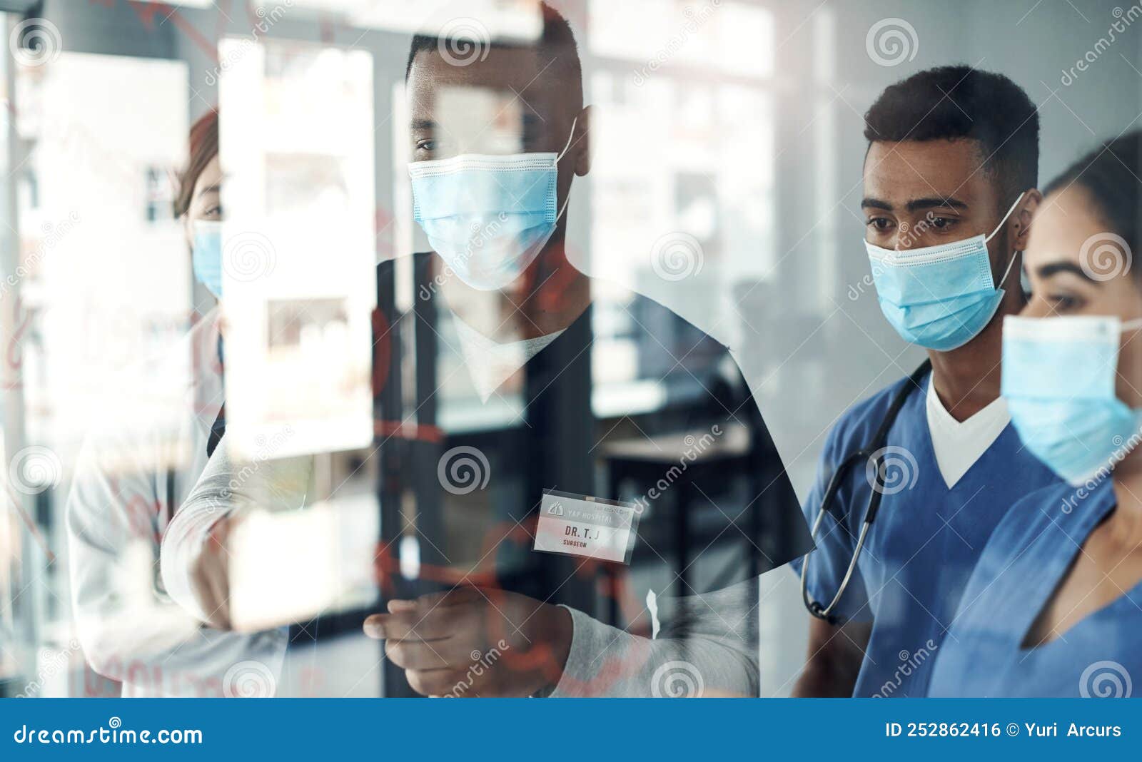 Sharing the Knowledge. Shot a Group of Doctors Discussing Formulas in ...