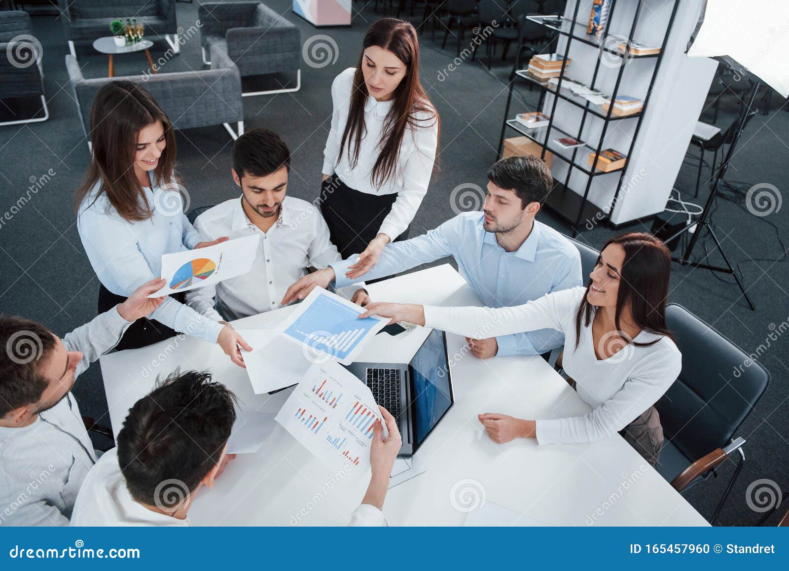 Sharing Papers with Graphs. Top View of Office Workers in Classic Wear ...