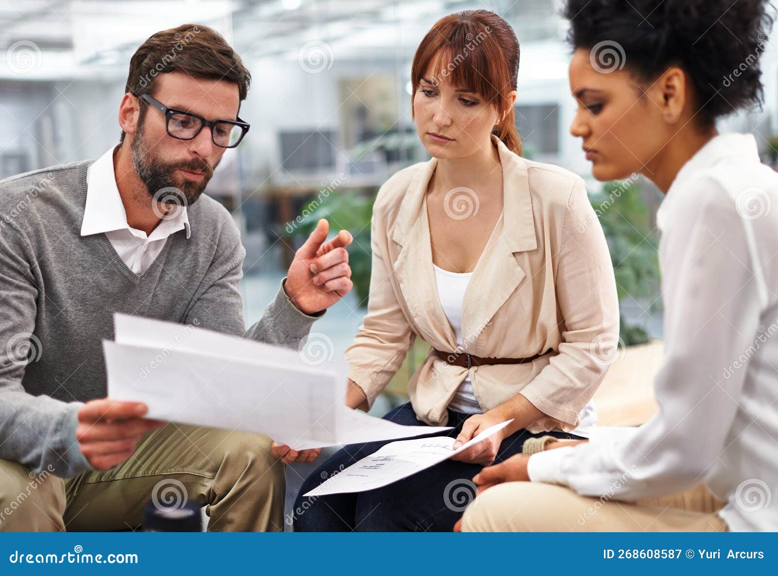 Sharing Project Ideas. a Diverse Group of Young Professionals Discussing Paperwork. Stock Image ...