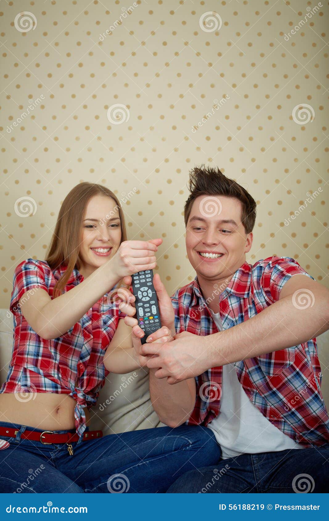 Sharing remote control stock image. Image of girlfriend - 56188219