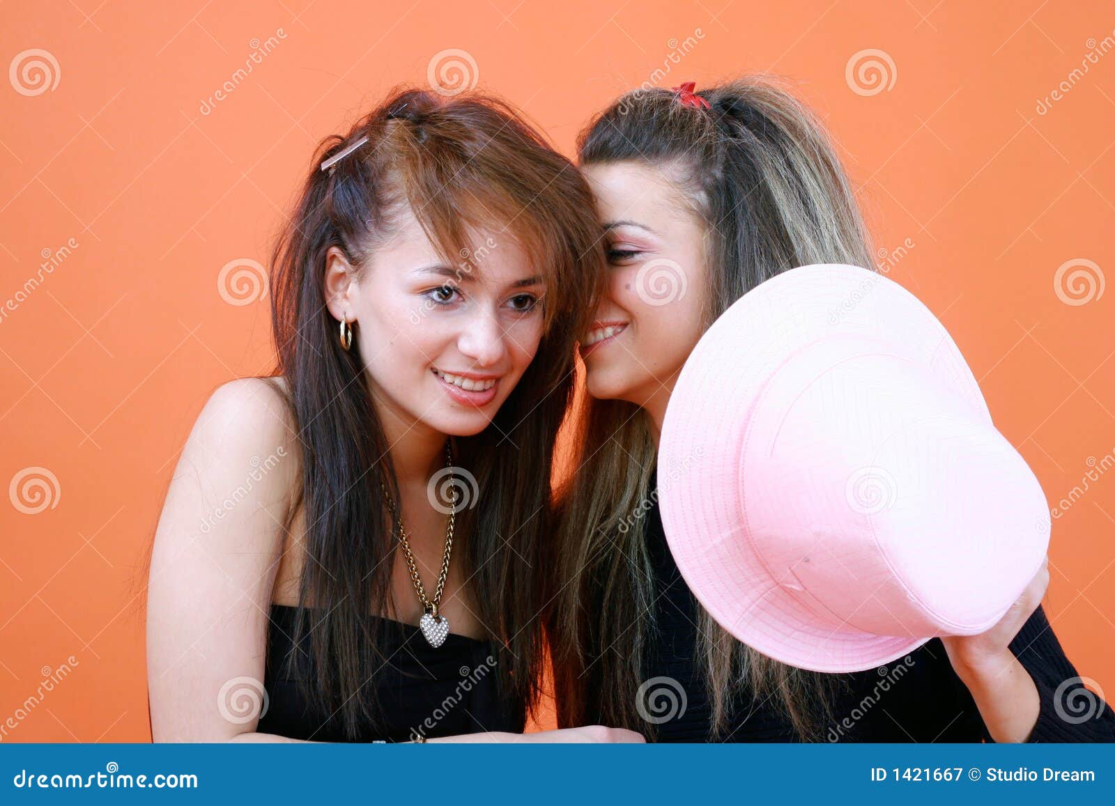 Sharing a secret 2 stock image. Image of cheeky, listen - 1421667