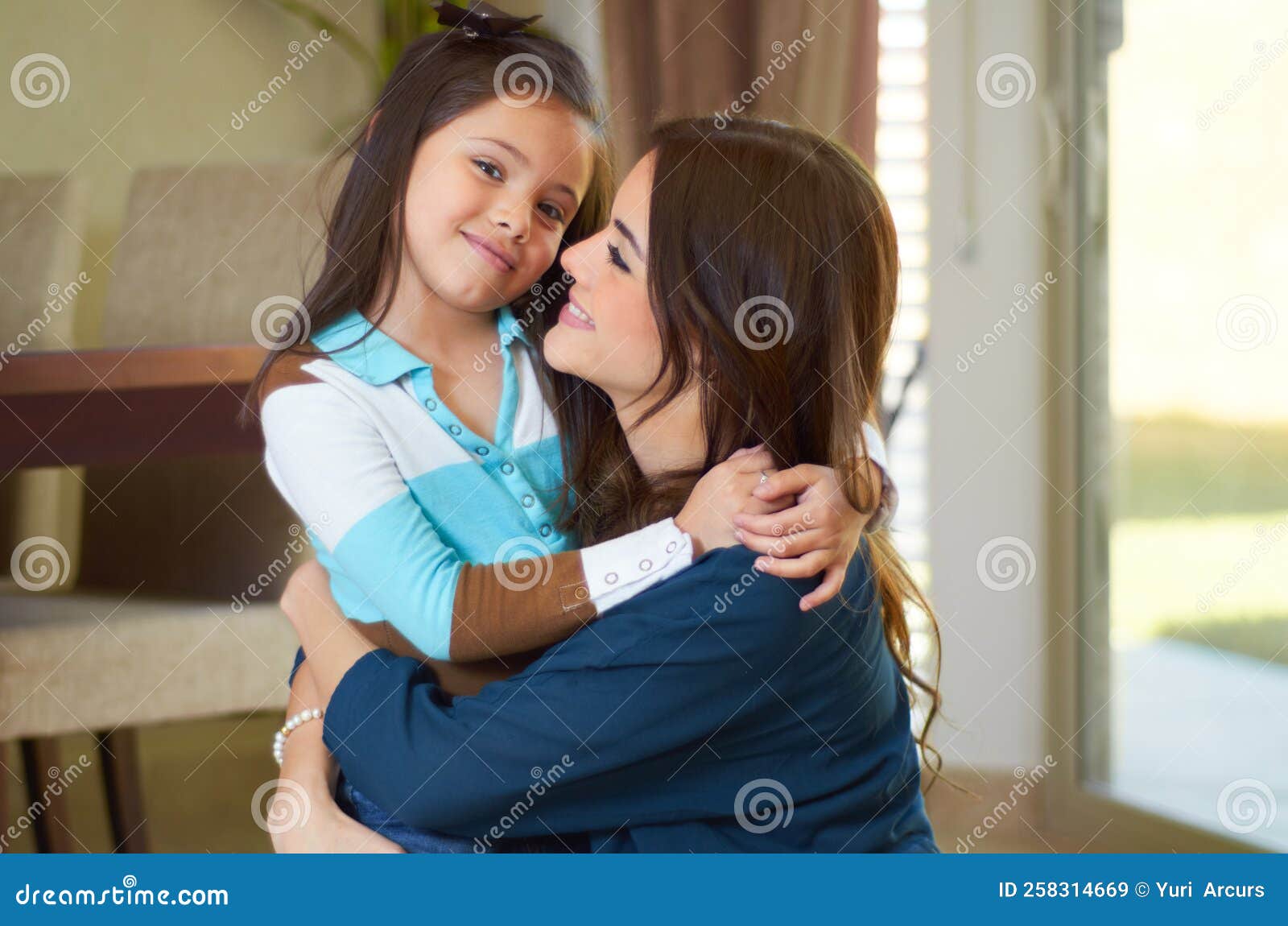Sharing a Special Closeness. Two Sisters Hugging Each Other while ... Sharing a Special Closeness. Two Sisters Hugging Each Other while ...