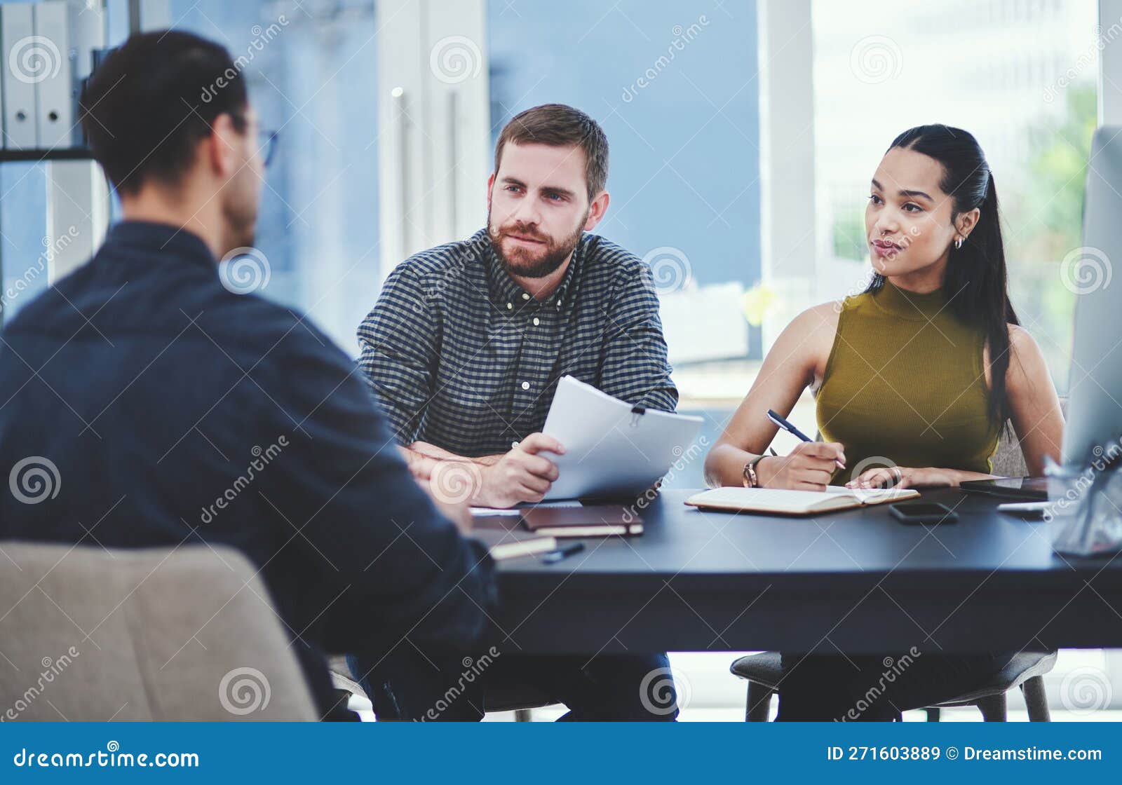 Sharing Thoughts and Ideas. Shot of a Group of Young Designers Having a ...