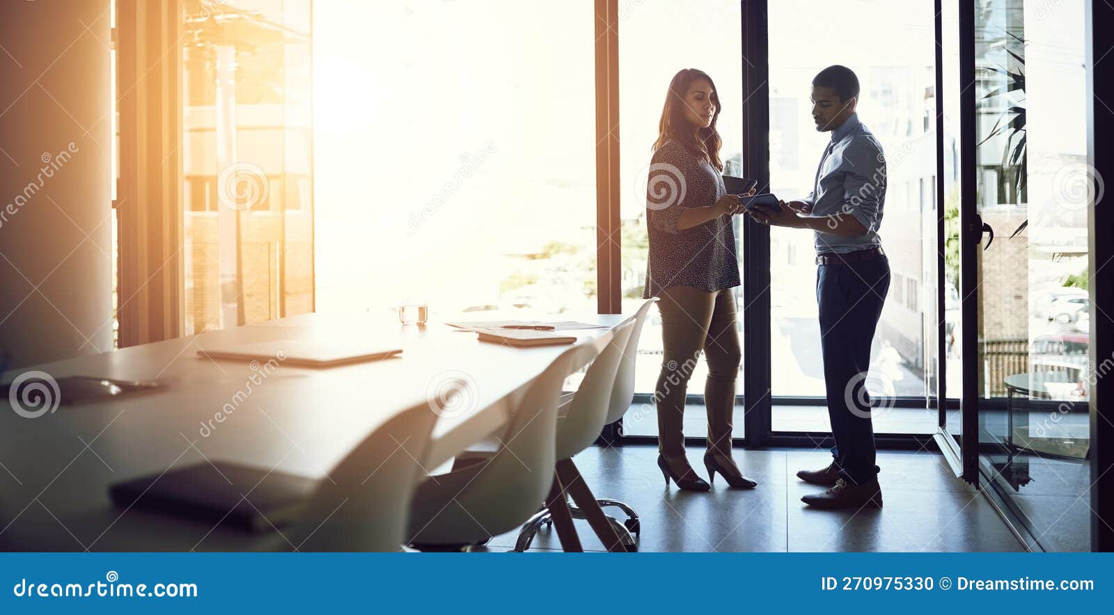 Sharing Valuable Contributions. Shot of Two Businesspeople Having a ...