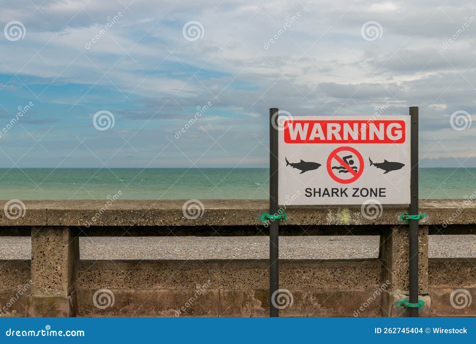 Shark Warning Information at the Beach with a Cloudy Sky Stock Photo ...