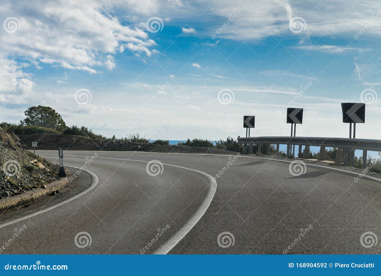 A Sharp Bend on an Empty Tarmac Road Stock Photo - Image of empty, edge ...