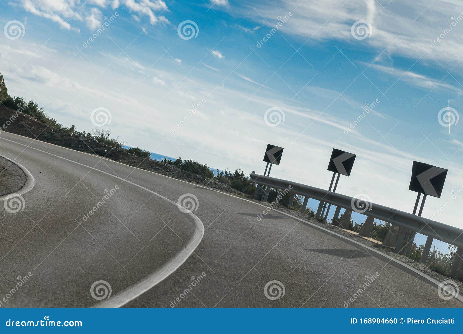 A Sharp Bend on an Empty Tarmac Road Stock Photo - Image of high ...
