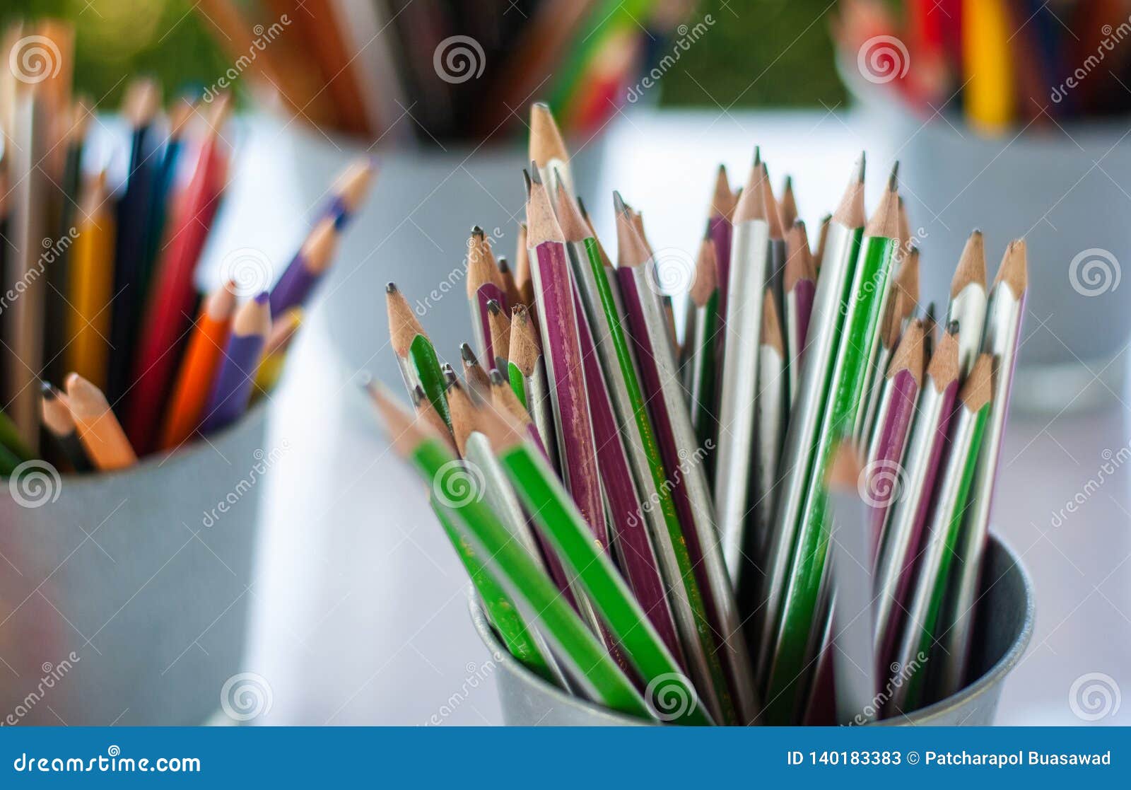 Sharp And Blunt Color Pencils Are Put In Bucket With Plaster Figure ...