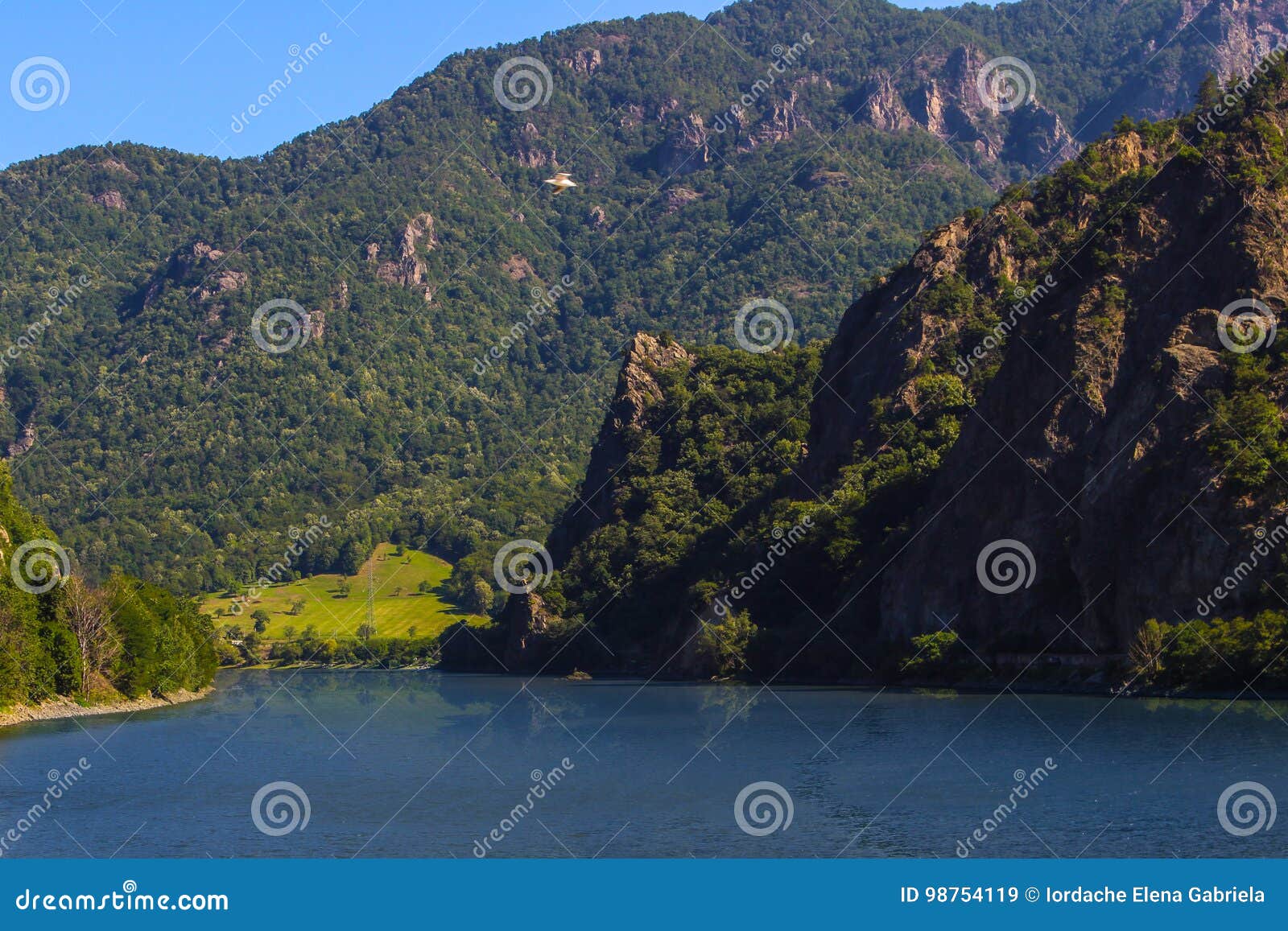 A sharp cliff near a lake stock image. Image of amazing - 98754119