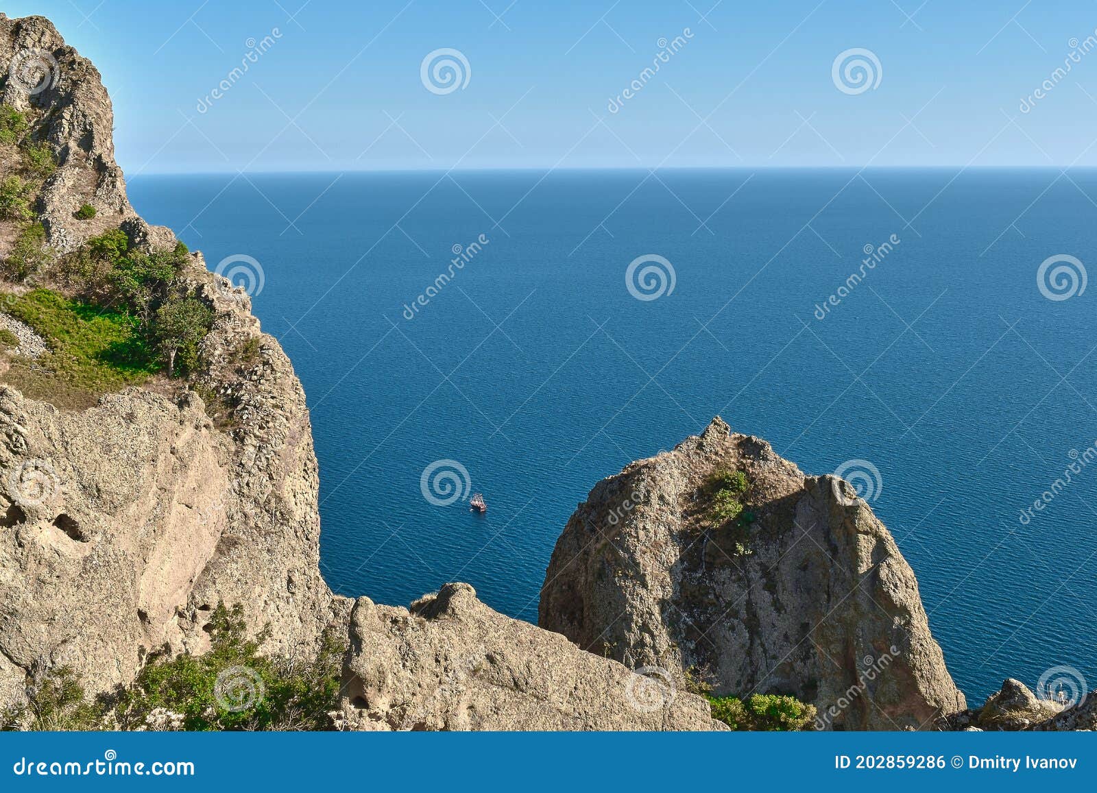 Sharp Cliffs with Small Green Bushes and the Sea Stock Photo - Image of ...