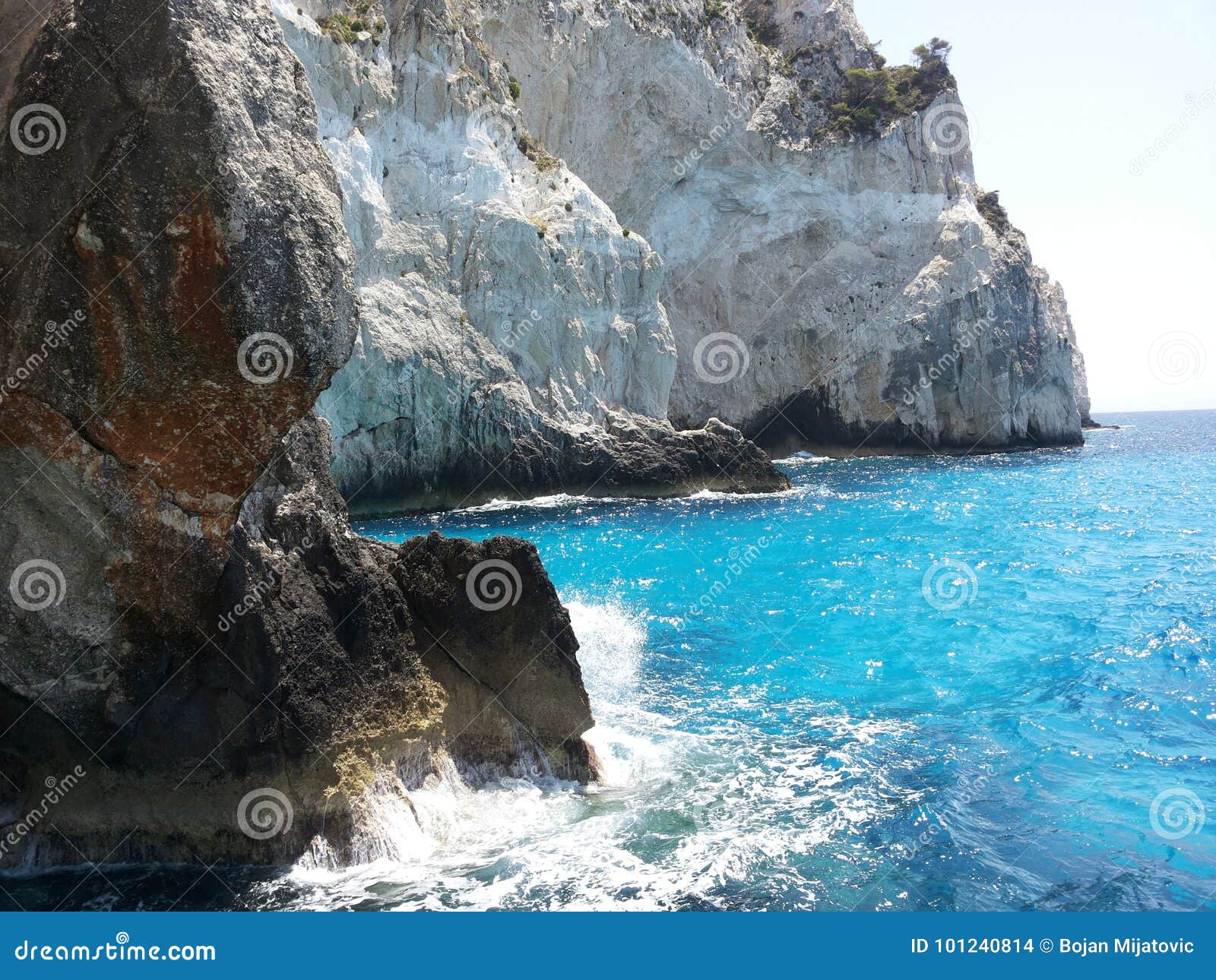 Sharp cliffs touching sea stock photo. Image of mountains - 101240814
