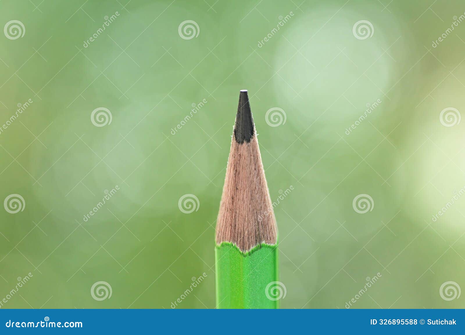 Sharp Green Pencil on Blur Nature Background with Bokeh Stock Photo ...