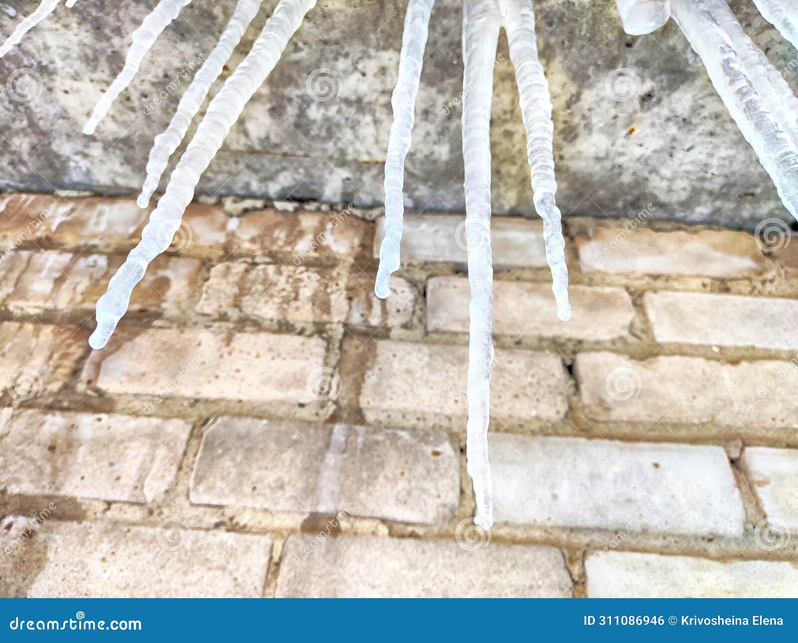 Sharp Icicles from Melted Snow Hanging from Eaves of Roof. Beautiful ...