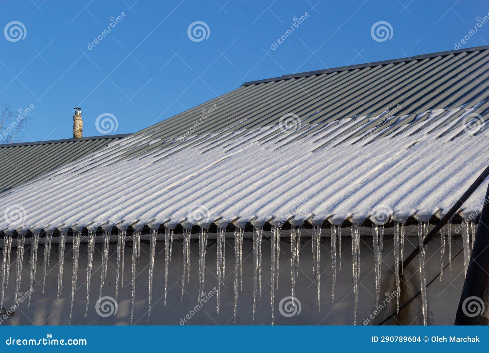 Sharp Icicles and Melted Snow Hanging from the Eaves of the Roof ...