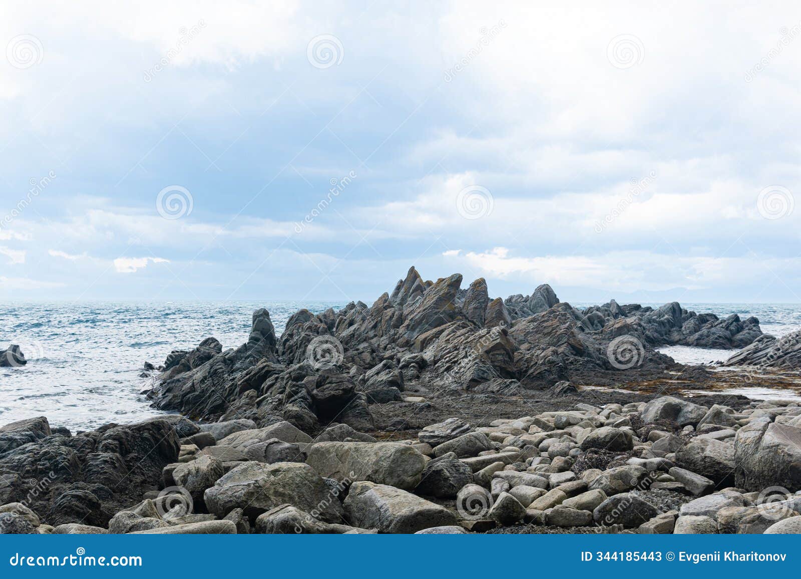 Sharp Jagged Basalt Rocks on the Sea Coast, Cape Stolbchaty on Kunashir ...