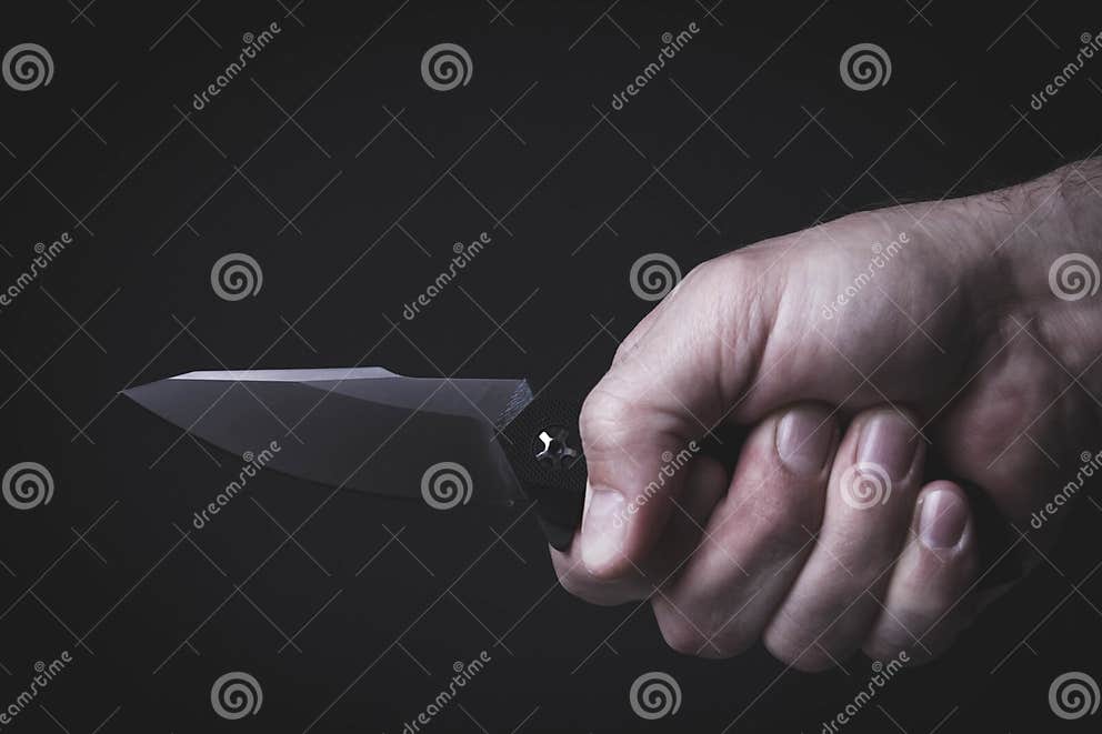 A Sharp Knife in the Man& X27;s Hand. the Use of Cold Weapons. Knife ...