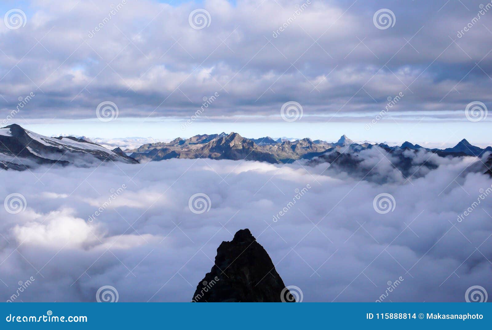 Sharp Mountain Peak and Great Landscape Behind with Cloud Cover in the ...