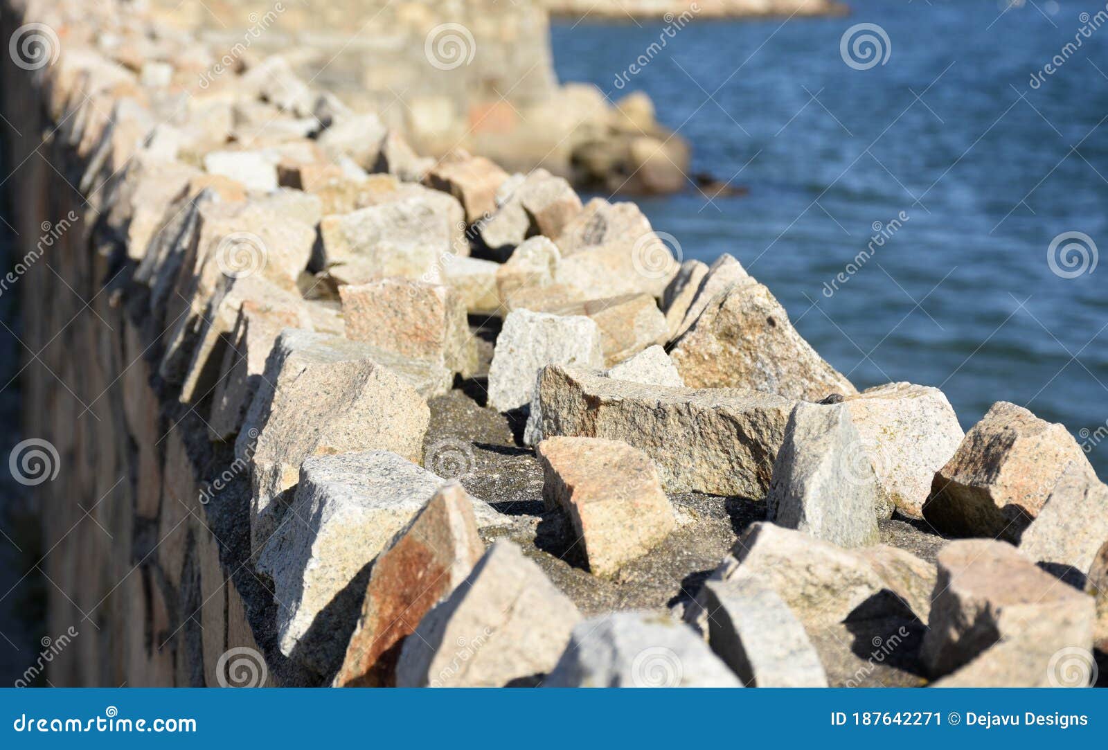 Sharp Rock Retaining Wall beside the Ocean Stock Image - Image of ...