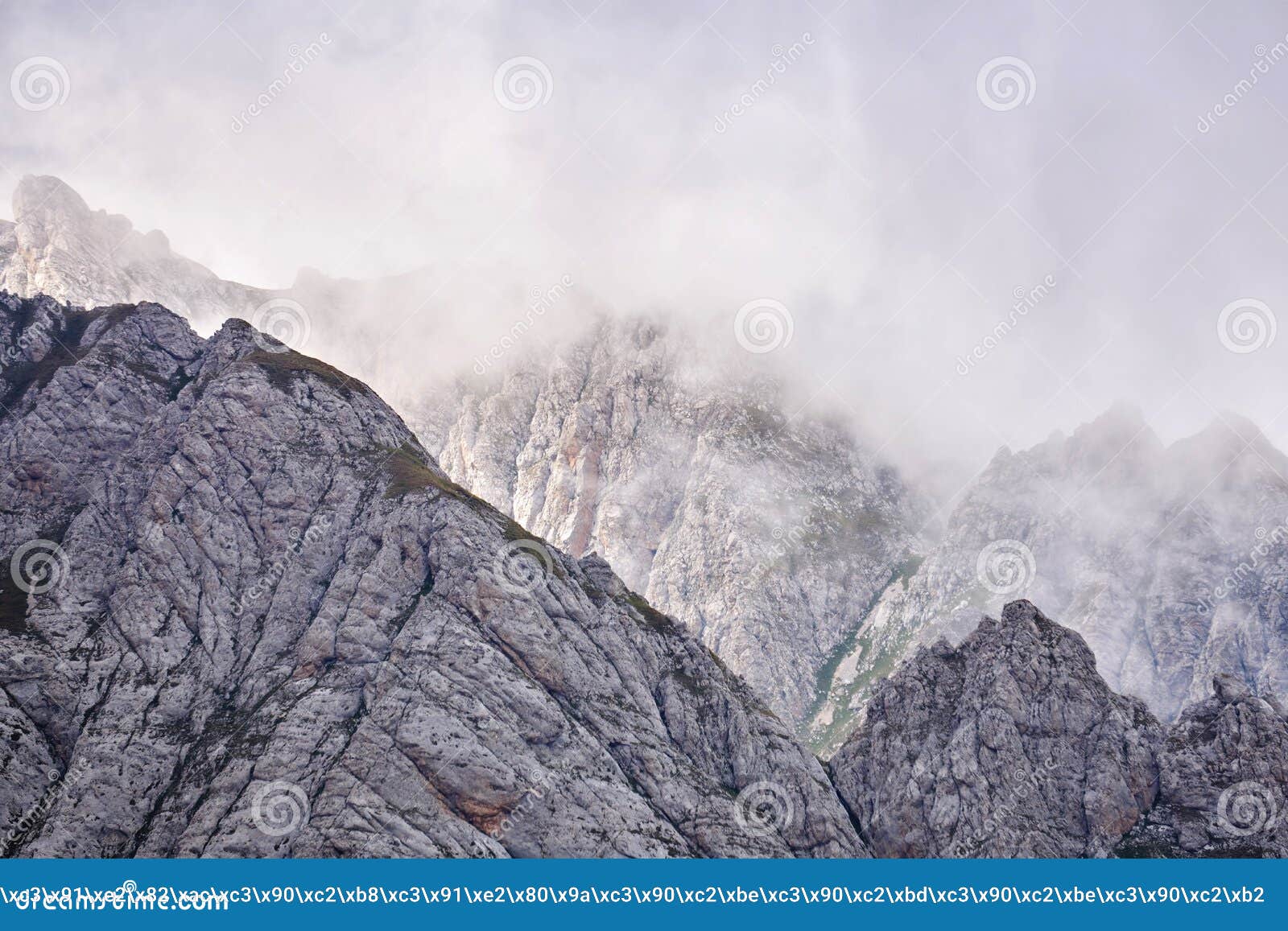 Sharp Rocky Mountain Peaks Lurk in the Clouds Stock Image - Image of ...