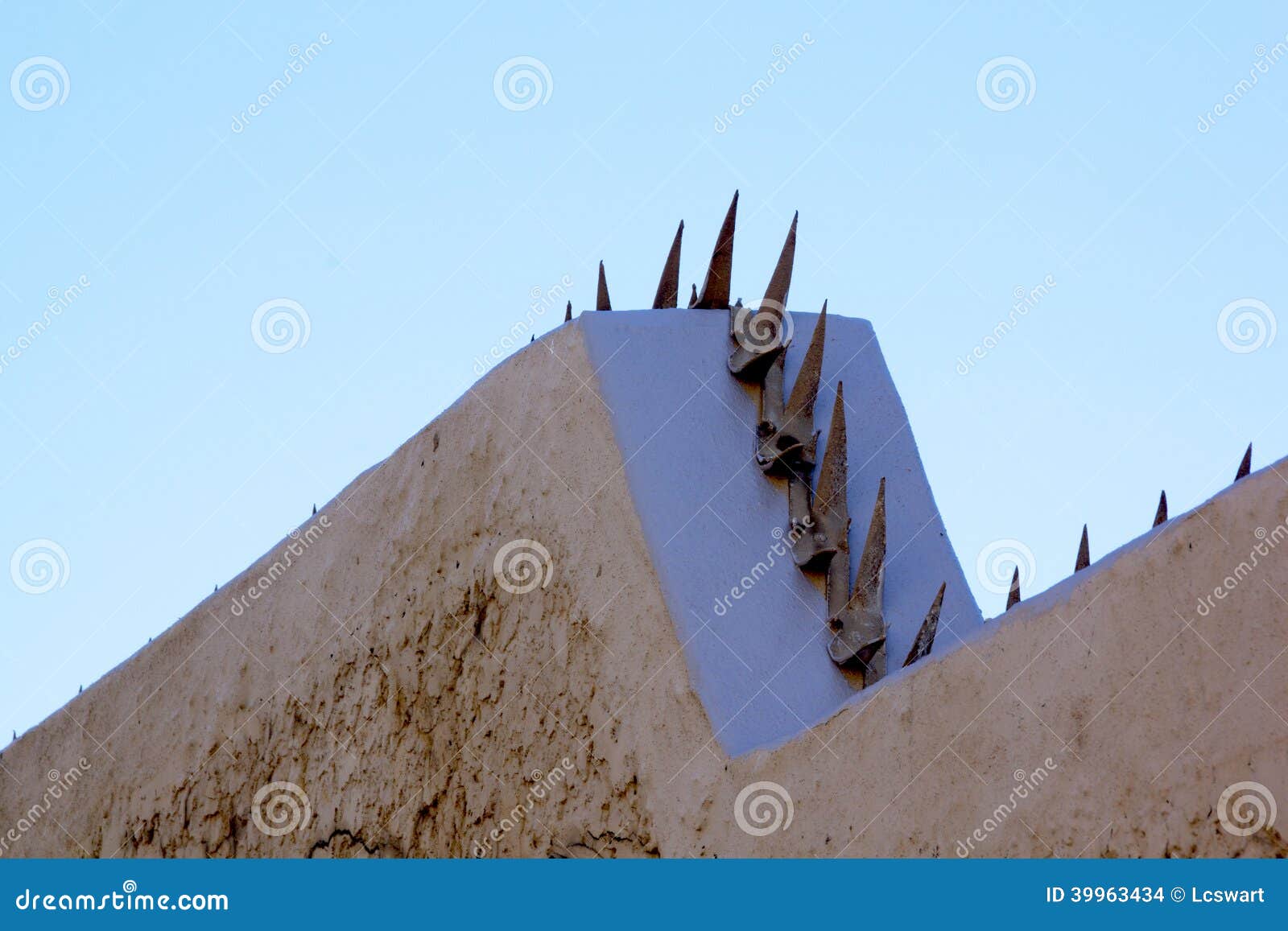 Sharp Rusty Spikes on Residential Boundary Wall Stock Photo - Image of ...