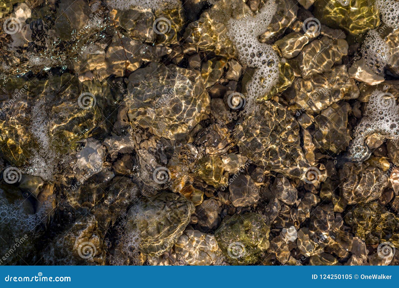 Sharp Sea Surface on the Pebbles Beach Reflecting Sun Rays.Use F Stock ...