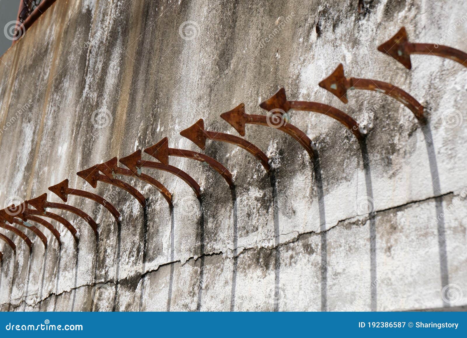 Sharp Steel Spikes on Concrete Wall Stock Image - Image of closeup ...