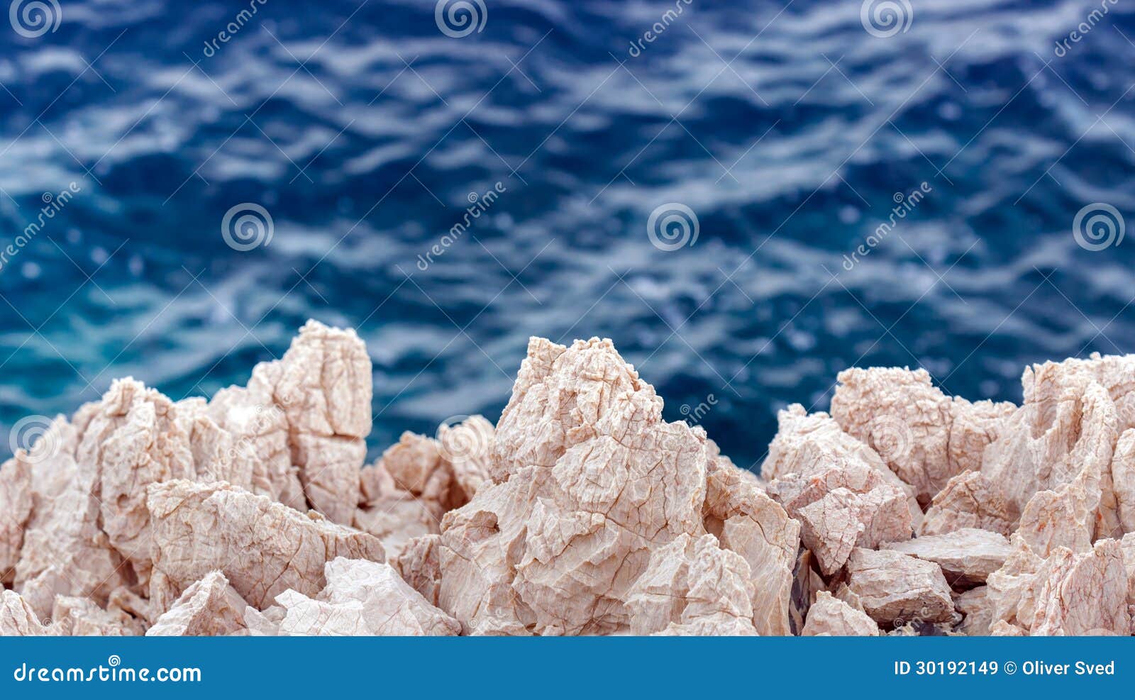 Sharp stones at the shores stock image. Image of rocks - 30192149