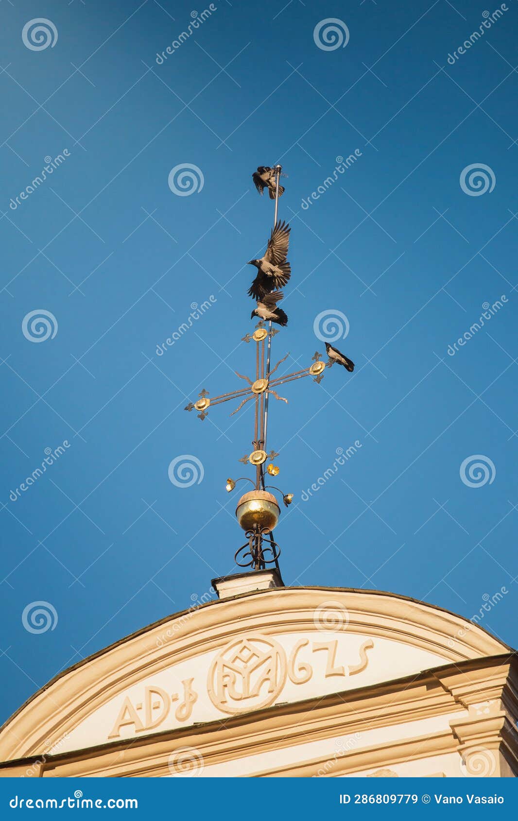 The Sharp Top of the Temple with a Cross and a Raven Stock Image ...