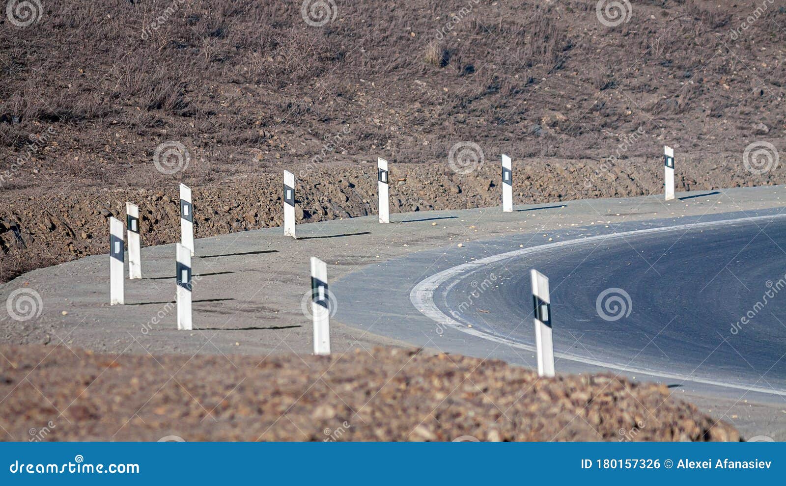 A Sharp Turn on an Asphalt Road Stock Photo - Image of barley, desert ...