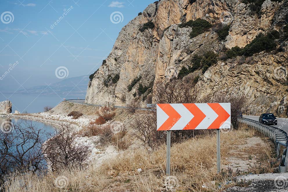 Sharp Turn Road Sign on a Serpentine Road Stock Photo - Image of symbol ...