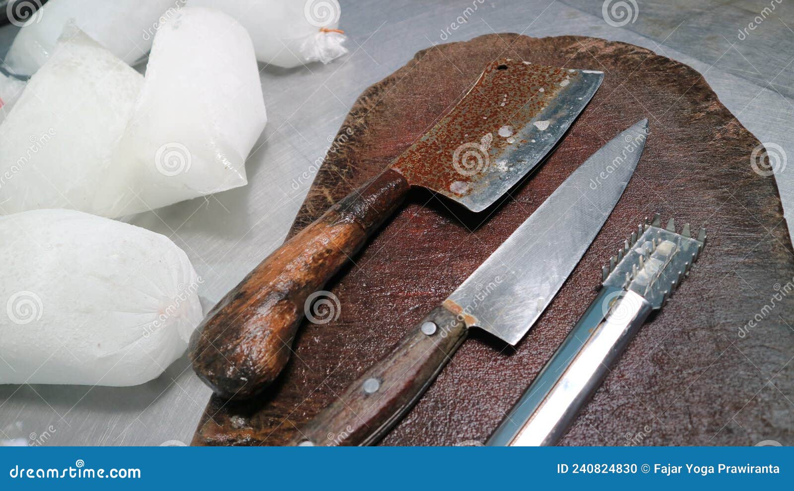 Sharp White Knife with Ice Cubes on the Table - Part 3 Stock Photo ...