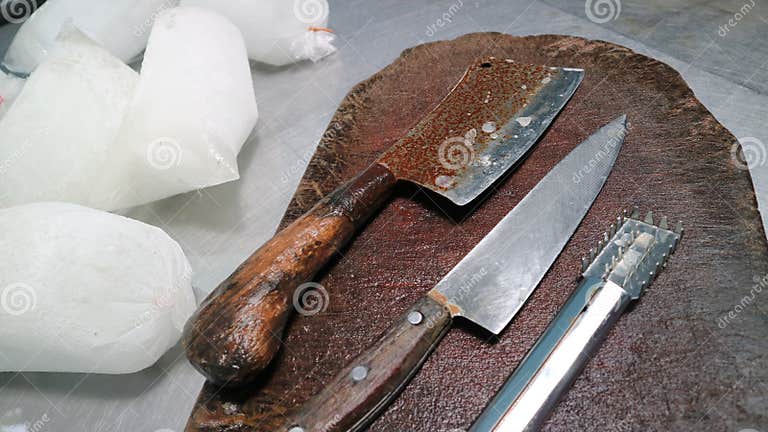 Sharp White Knife with Ice Cubes on the Table - Part 3 Stock Photo ...