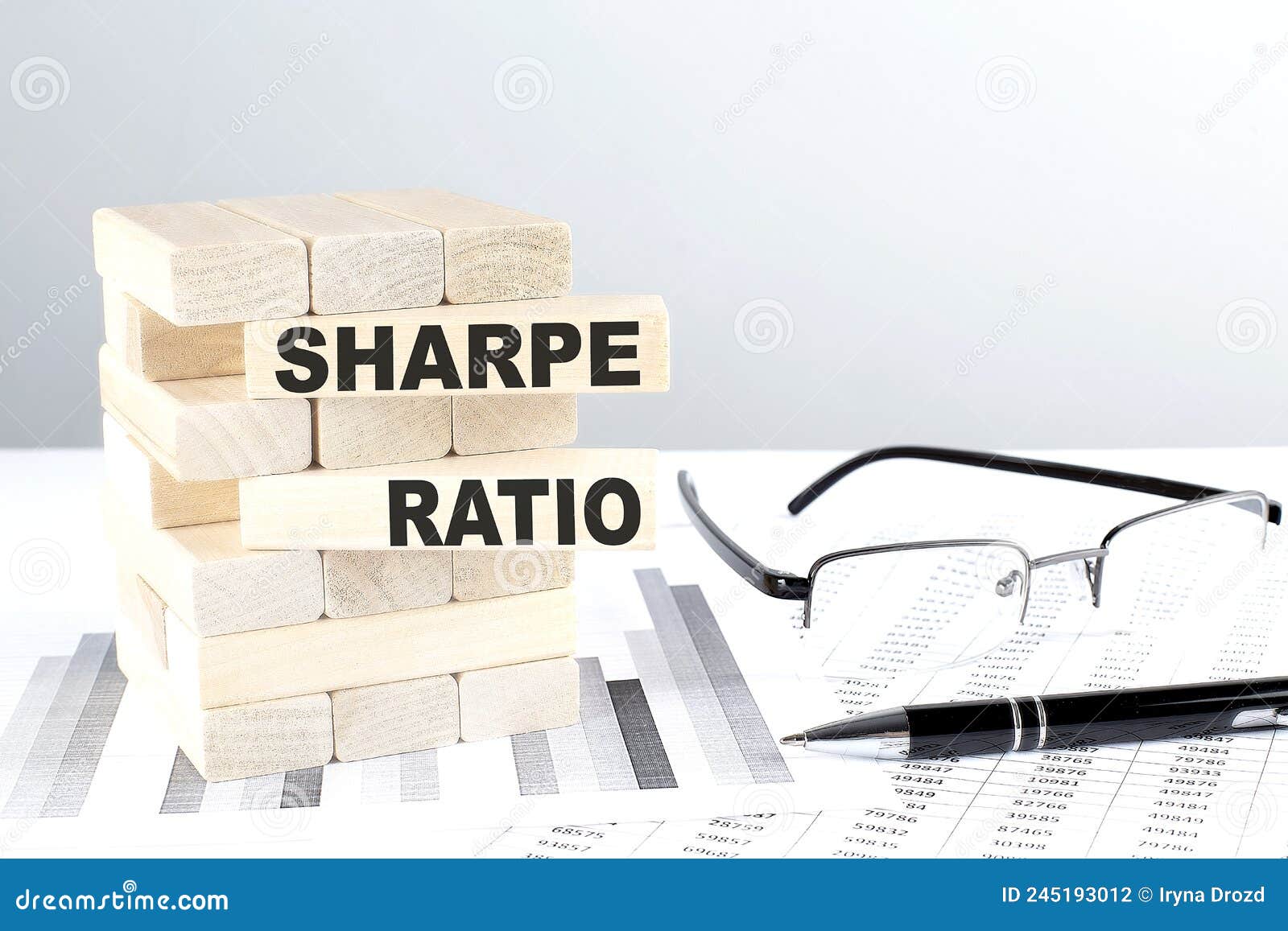 SHARPE RATIO is Written on Wooden Blocks on a Chart Background Stock ...