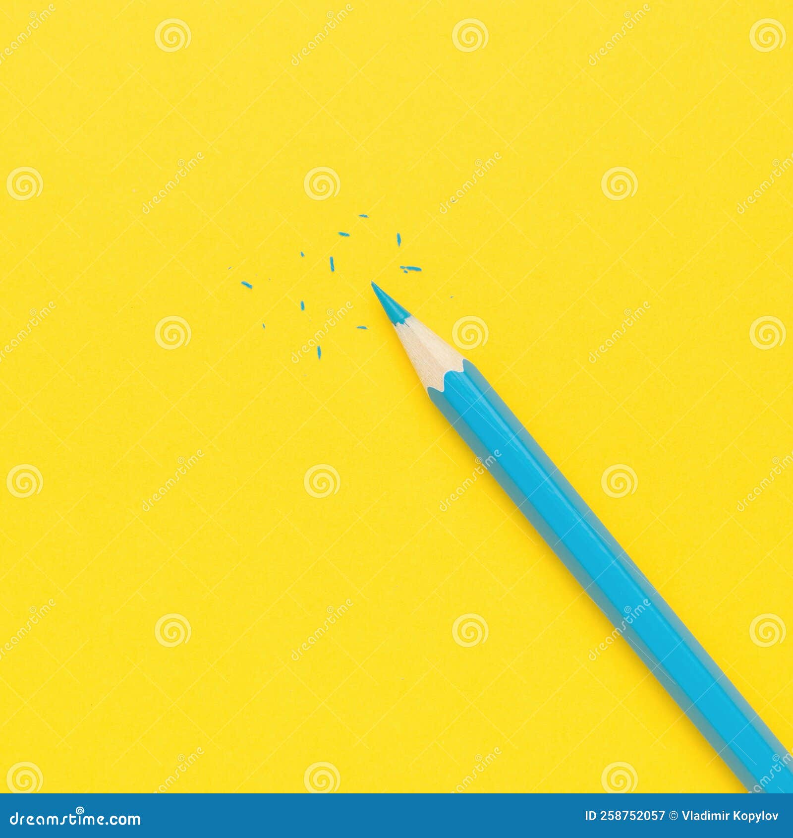 Sharpened Blue Pencil on a Light Yellow Background Stock Image - Image ...