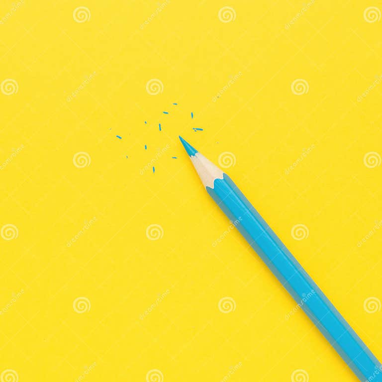 Sharpened Blue Pencil on a Light Yellow Background Stock Image - Image ...