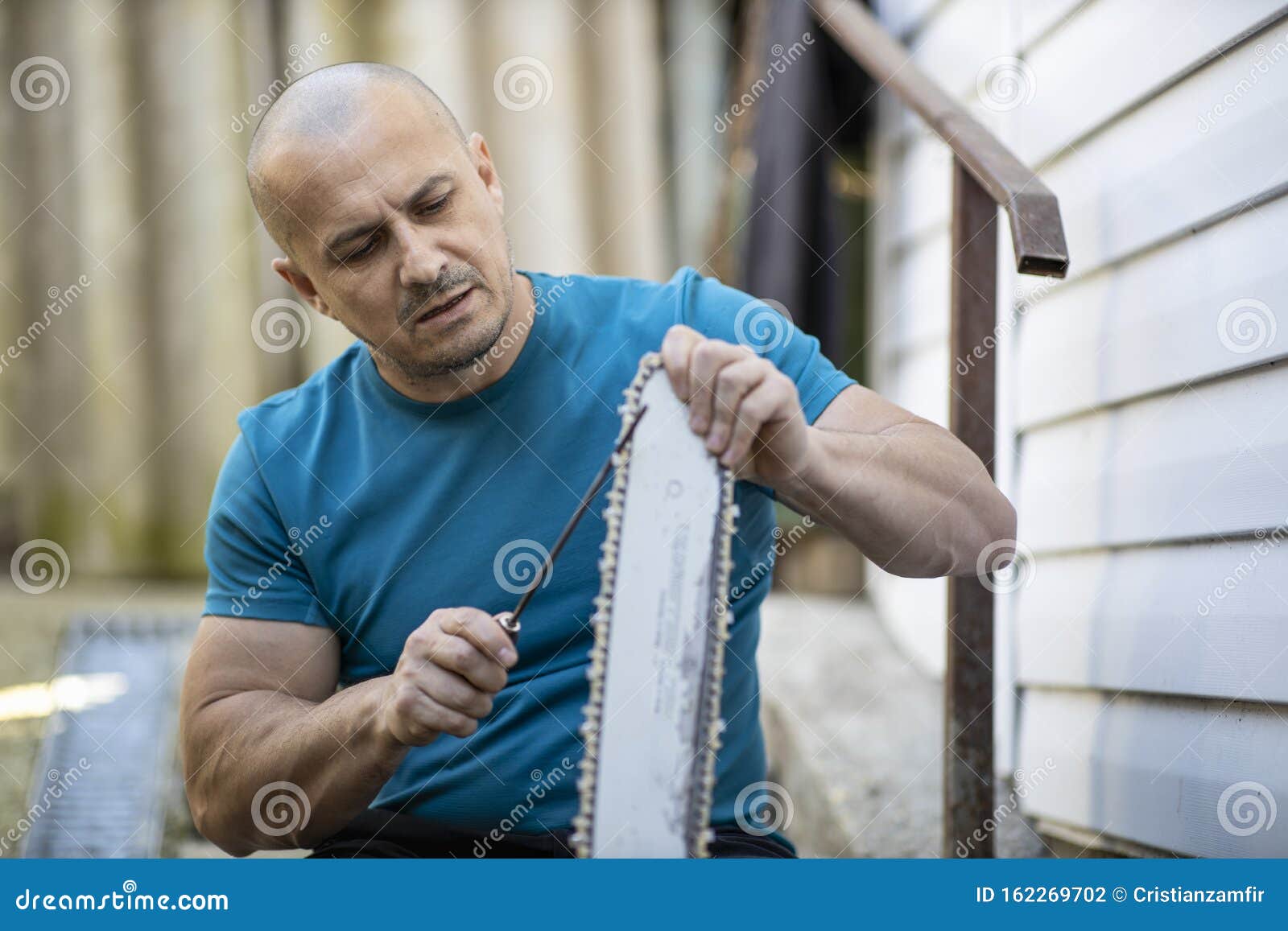 Sharpening a chainsaw stock photo. Image of blade, repair - 162269702