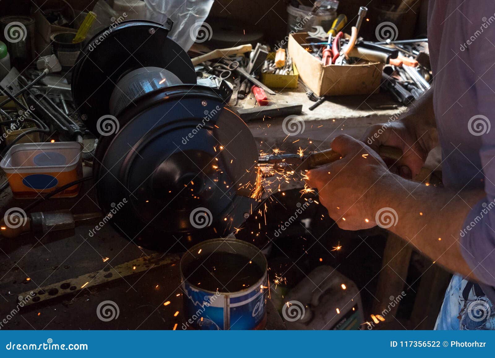 Sharpening a Chisel on Grinding Machine with Sparks Fly Stock Photo ...