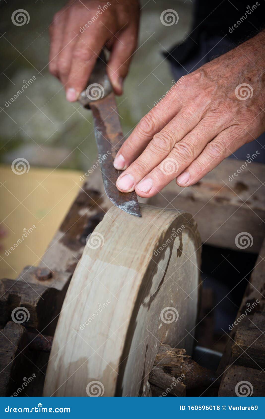 Sharpening Knife on Old Grindstone Wheel Stock Photo - Image of ...
