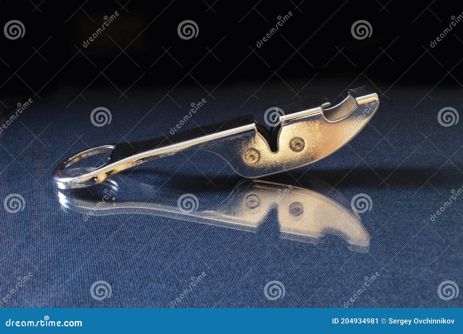 Sharpening the Knife from Steels Rests upon Turn Blue Table with ...