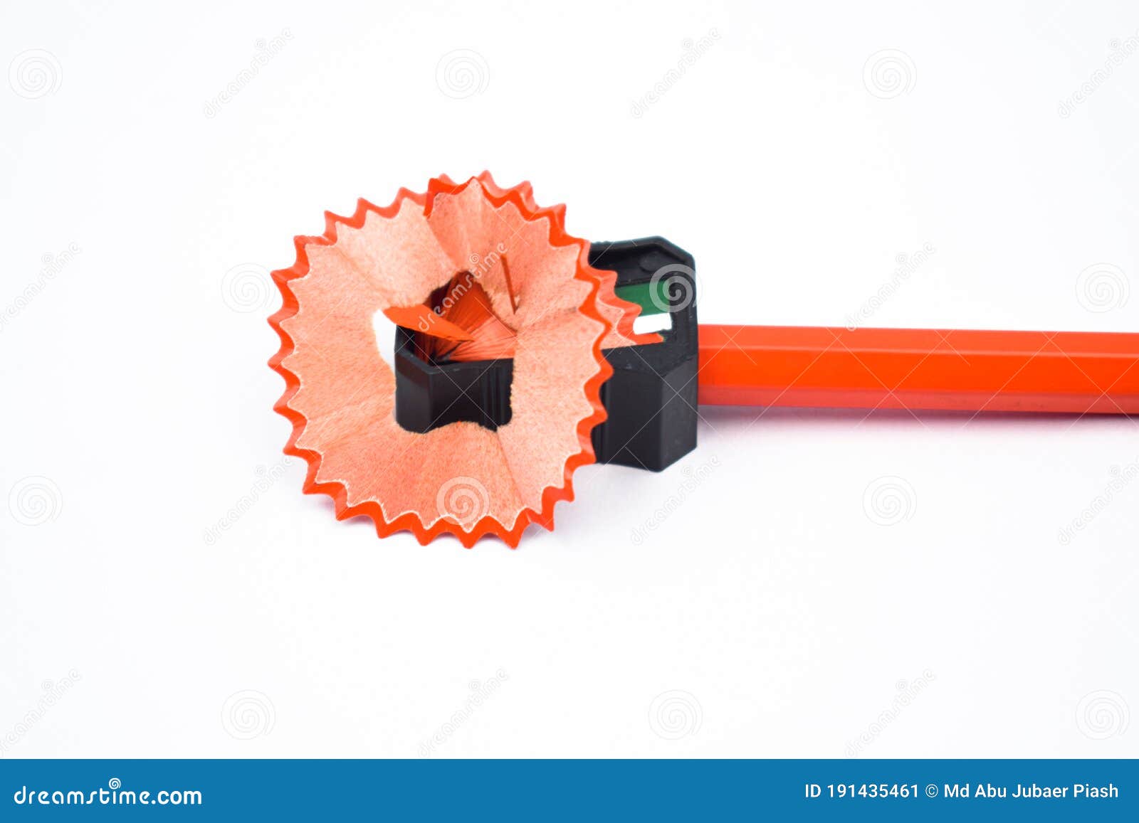 Sharpening a Orange Color Wood Pencil Crayon with a Black Color Plastic ...