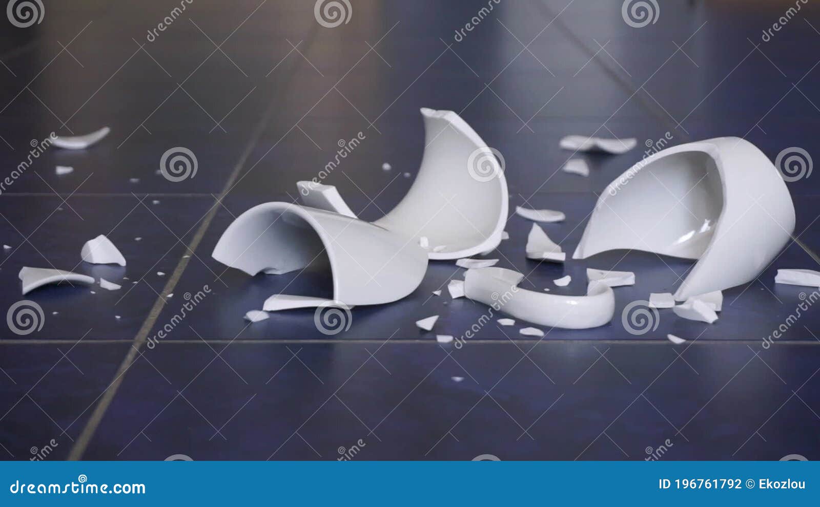 Broken Cup. Shards from the Cup are Scattered on the Floor Stock ...