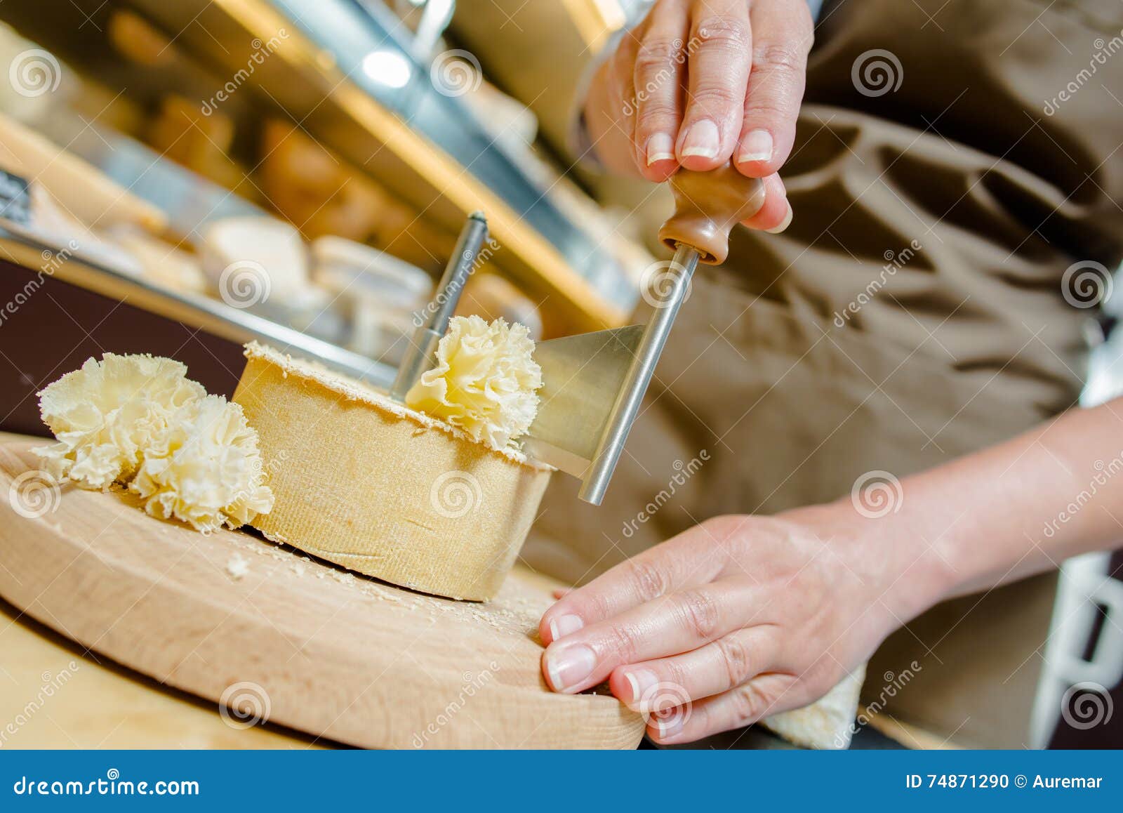 Shaving layers off cheese stock photo. Image of natural - 74871290
